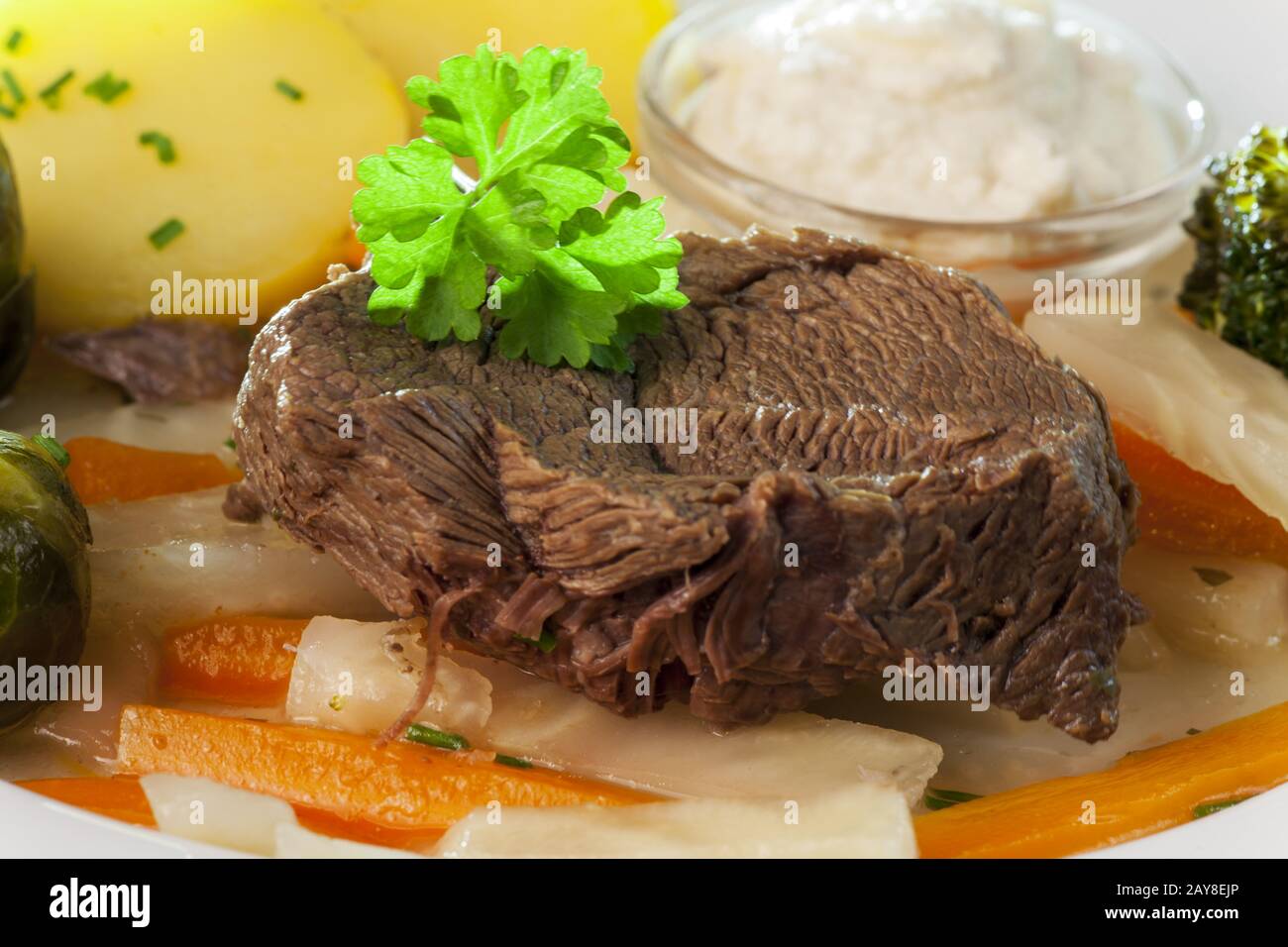 Boiled beef on a plate with vegetables Stock Photo - Alamy