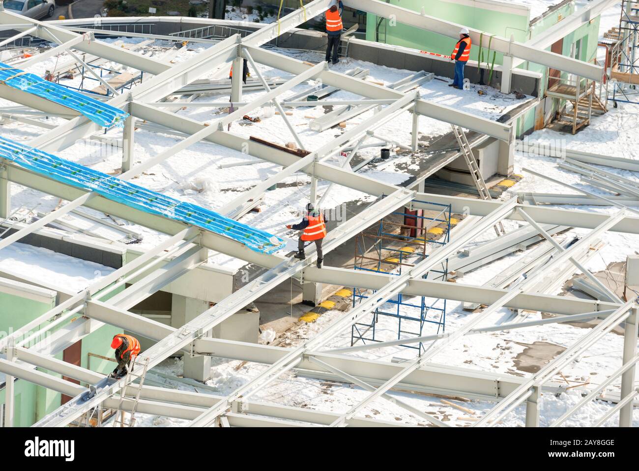 Workers on the building roof Stock Photo - Alamy
