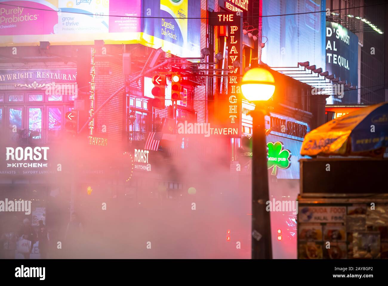 The steam drifts and surrounds the Subway Globes Light and cityscape in ...