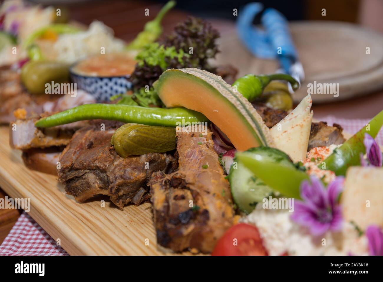 cold buffet as appetizer arranged on a wooden plate - close-up Stock ...