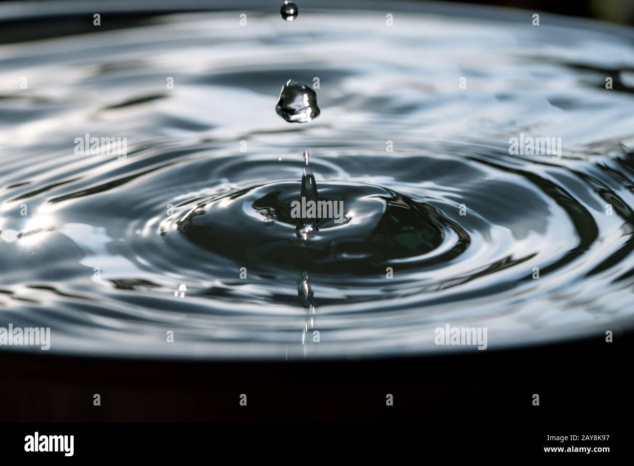 Water Drop splash with sun Stock Photo - Alamy