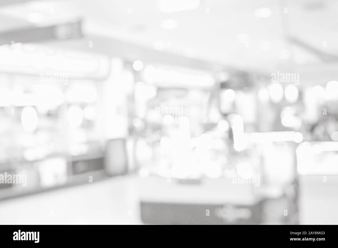 Grey or White blurred of department store background. Defocused blur ...