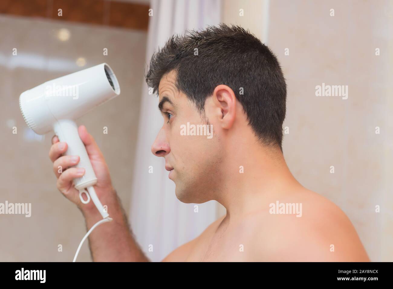 Man holding hairdryer hi-res stock photography and images - Alamy
