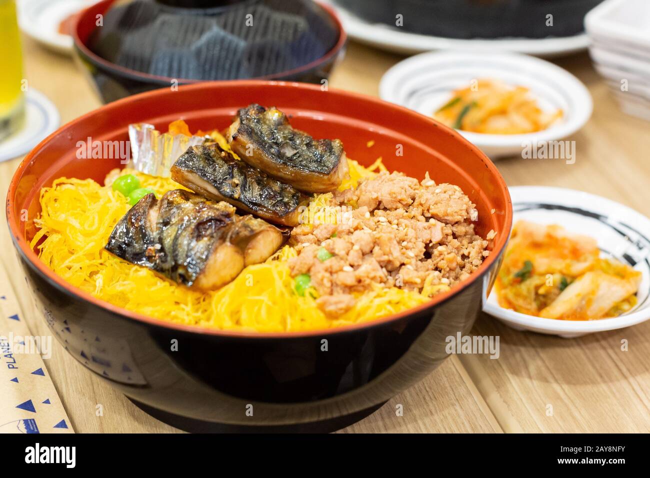 Box of grilled Saba fish, omelette, salad, garlic fried rice and kimchi ...