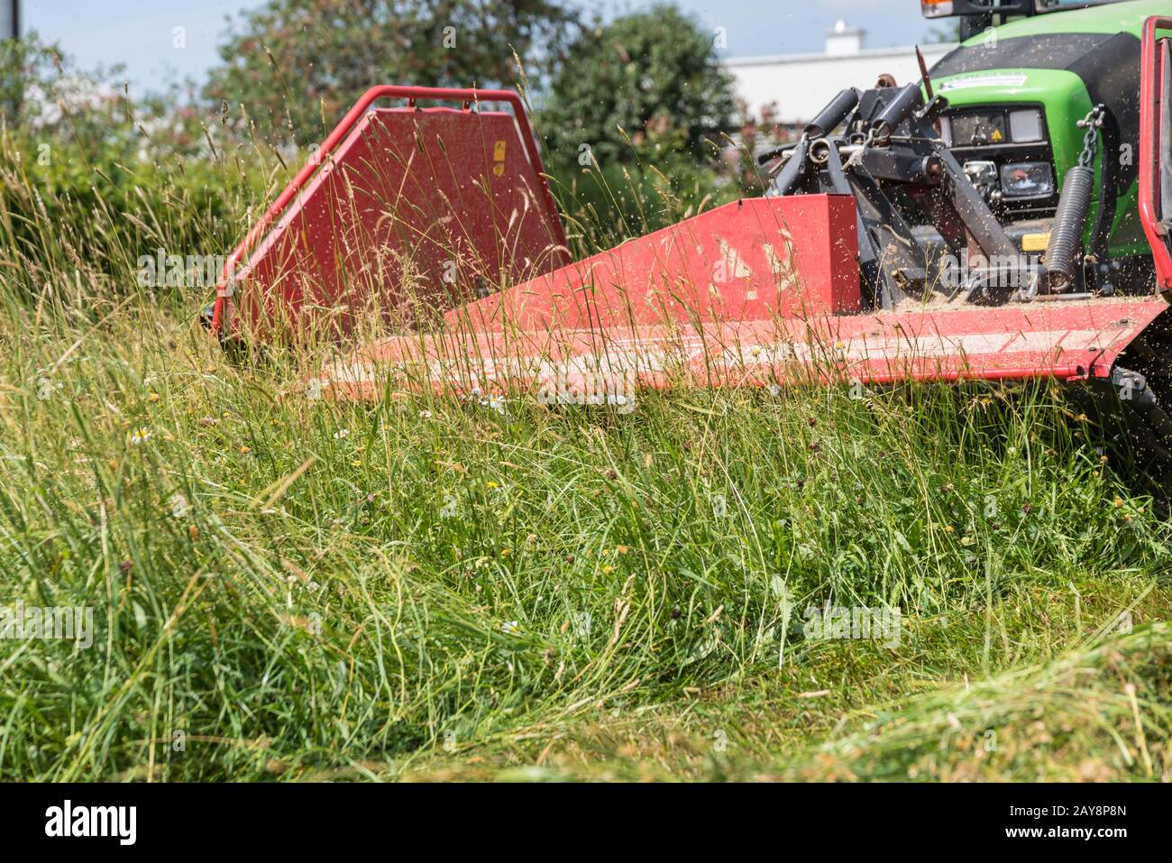 Mowing green forage with tractor and front mower - Detail Stock Photo ...