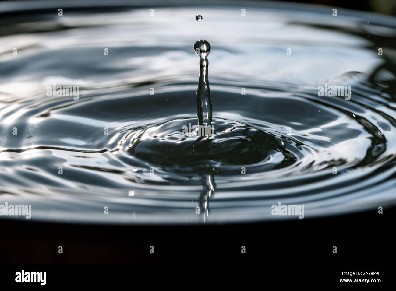 Water Drop splash with sun Stock Photo - Alamy