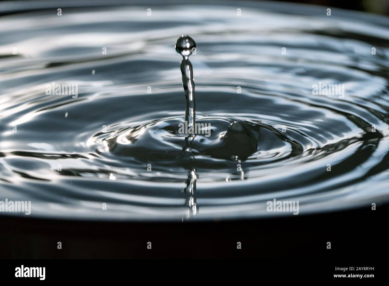 Water Drop splash with sun Stock Photo - Alamy