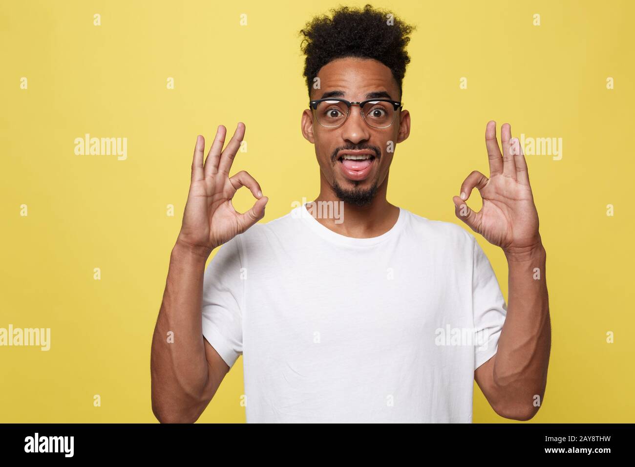 Portrait Of Happy African American Man Showing Ok Sign And Smiling