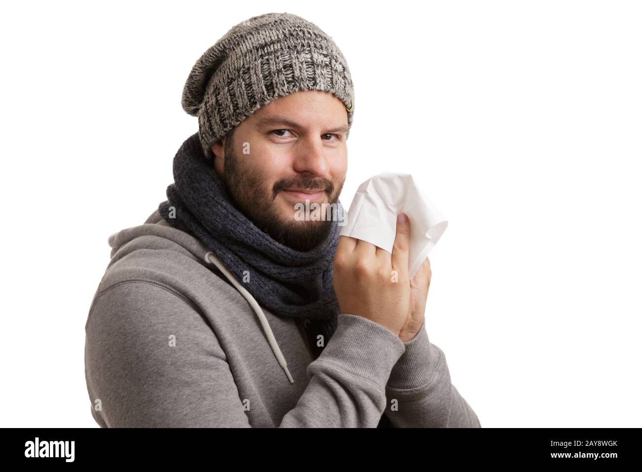 A man in winter time with disease has to sneeze and blow into a ...