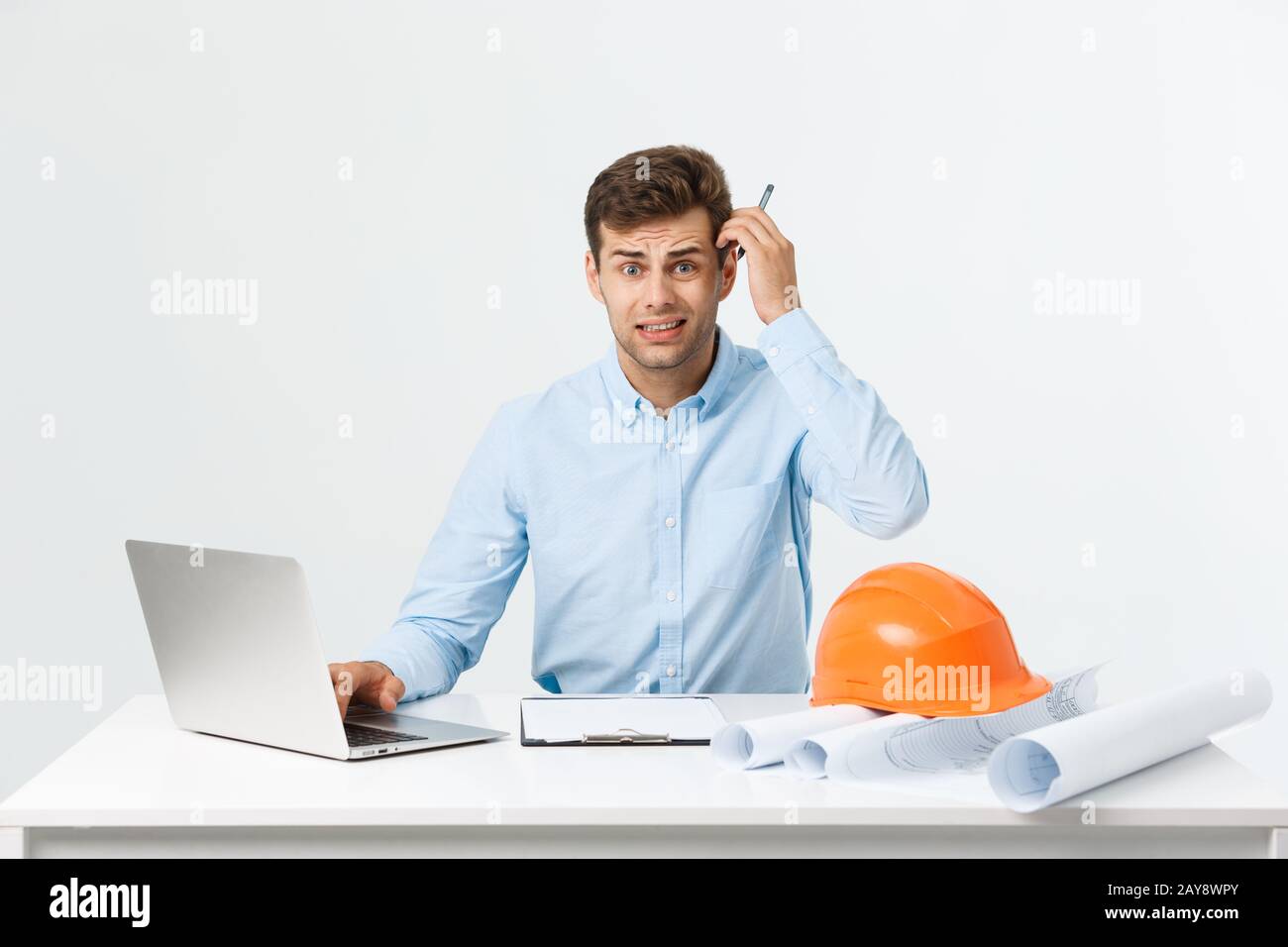 Serious man businessman or engineer sitting in construction site ...