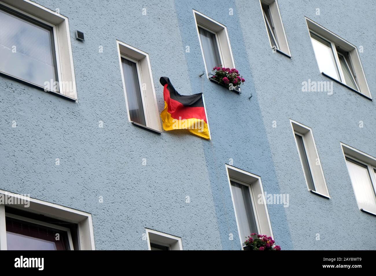 House facade with flag of Germany Stock Photo - Alamy