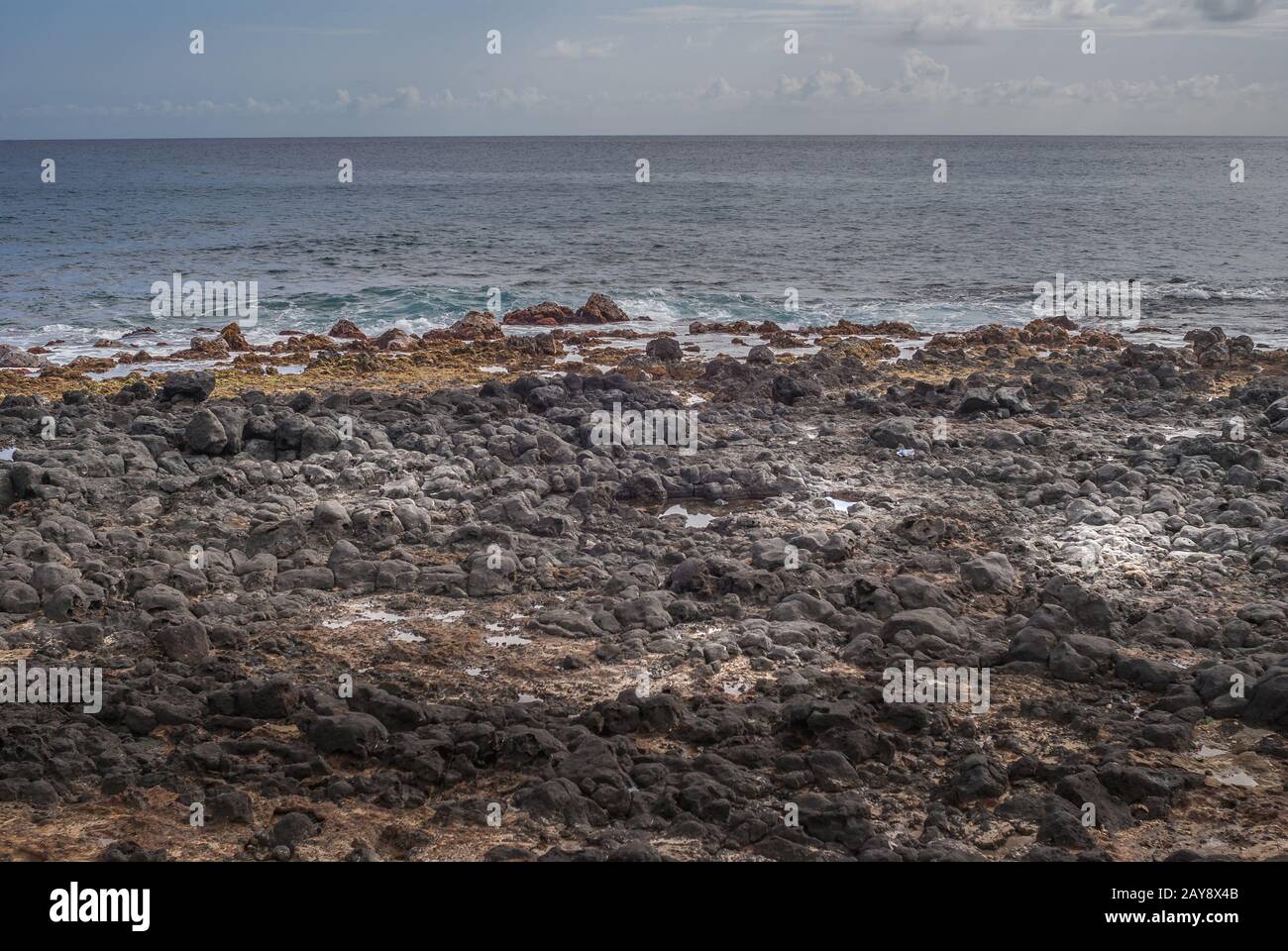 Kauai, Hawaii, USA. - January 11, 2012: Black lava rocks at Kawailoa ...