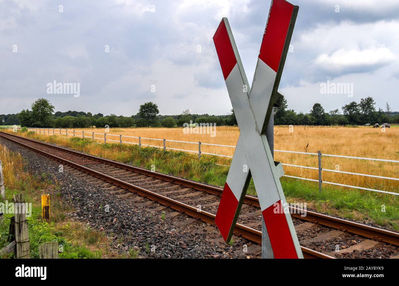 Railroad crossing at a country road on a summer day Stock Photo - Alamy