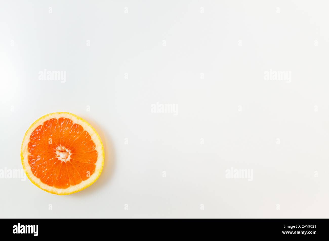 Top view of single grapefruit slice on white background Stock Photo - Alamy