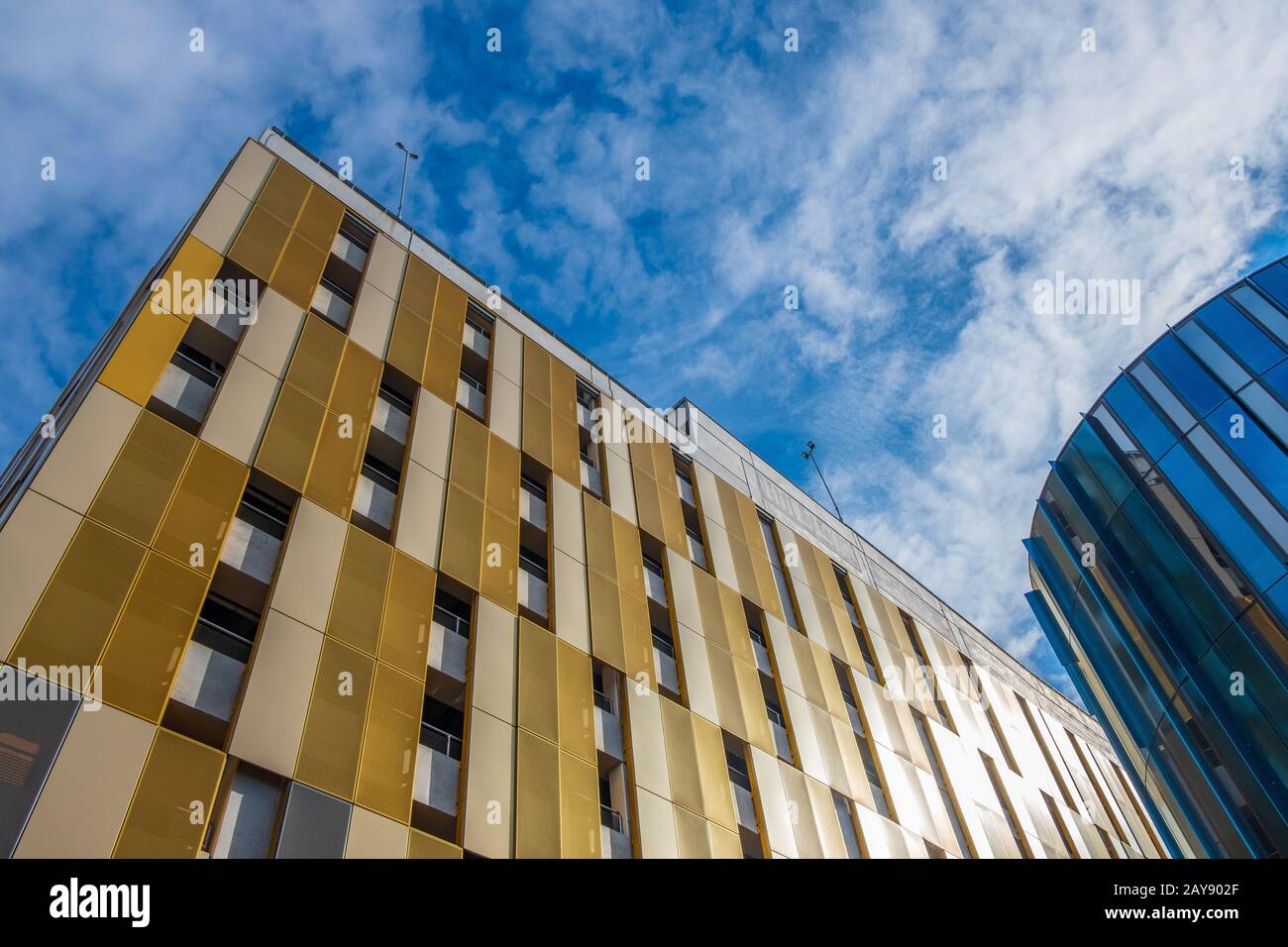 Contrasting colors and shapes on building facades against the sky in ...