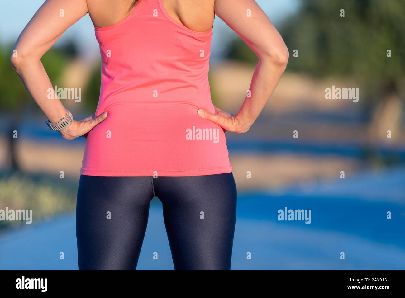 Portrait of beautiful woman ready to start running, back view Stock ...