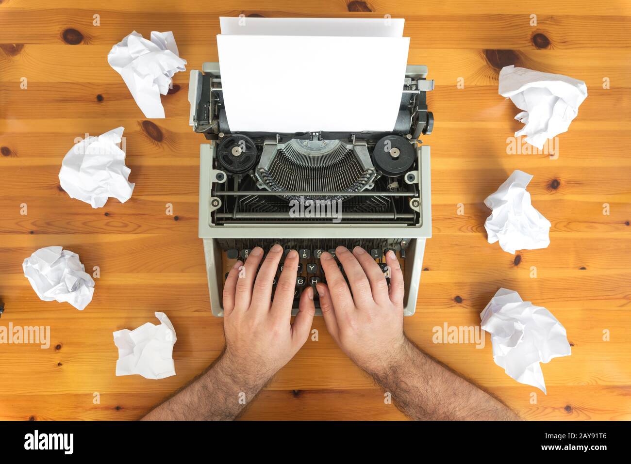 Writer's block. Typewriter and crumpled paper on work desk. Creative ...