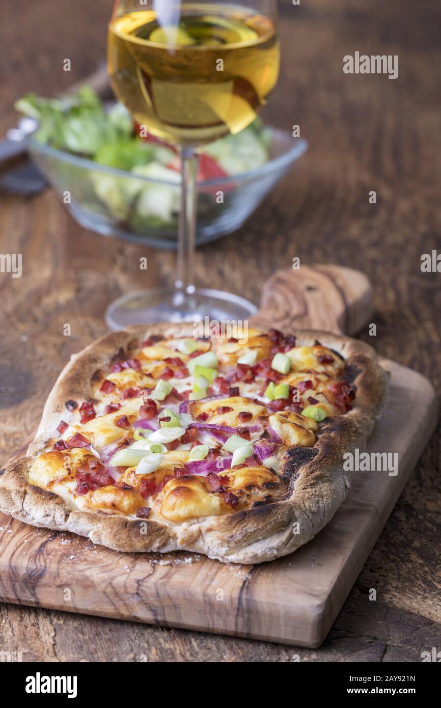 homemade French tarte flambée with wine Stock Photo - Alamy