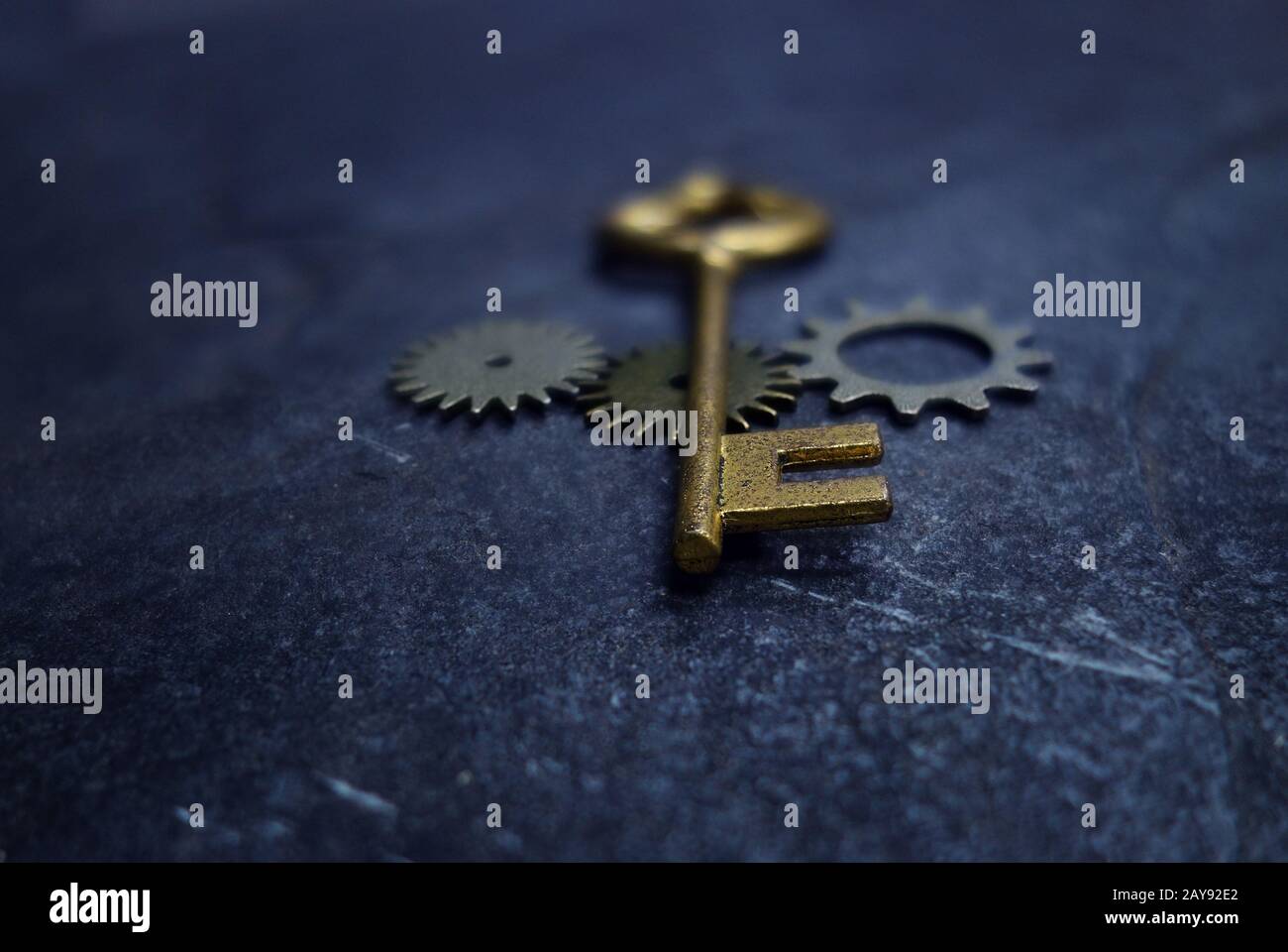 Vintage key and gears Stock Photo - Alamy