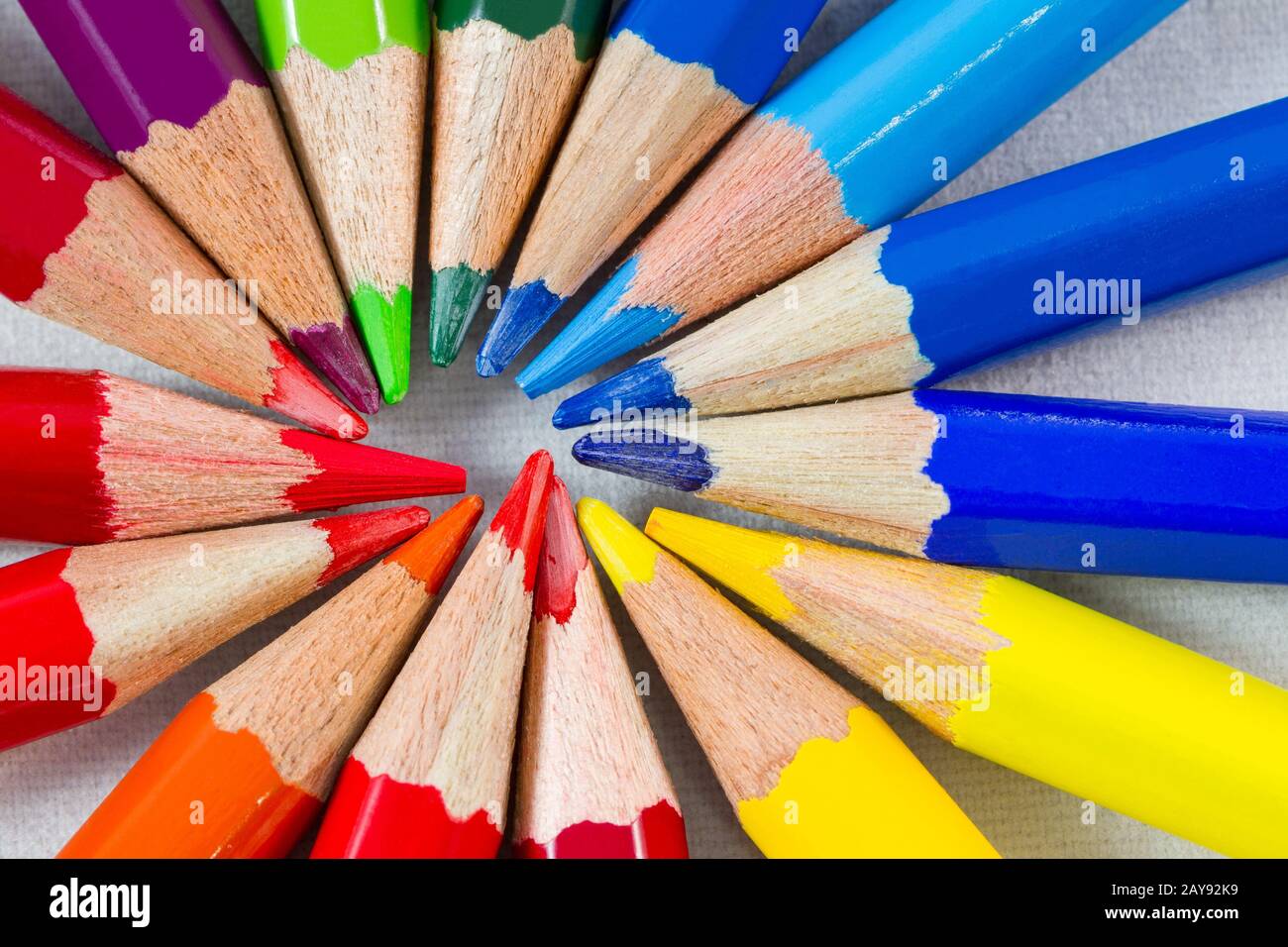 Color pencils in round formation on white background extreme close-up ...