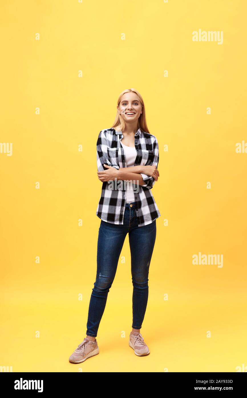 Full length laughing model in studio. looking at camera. isolated ...