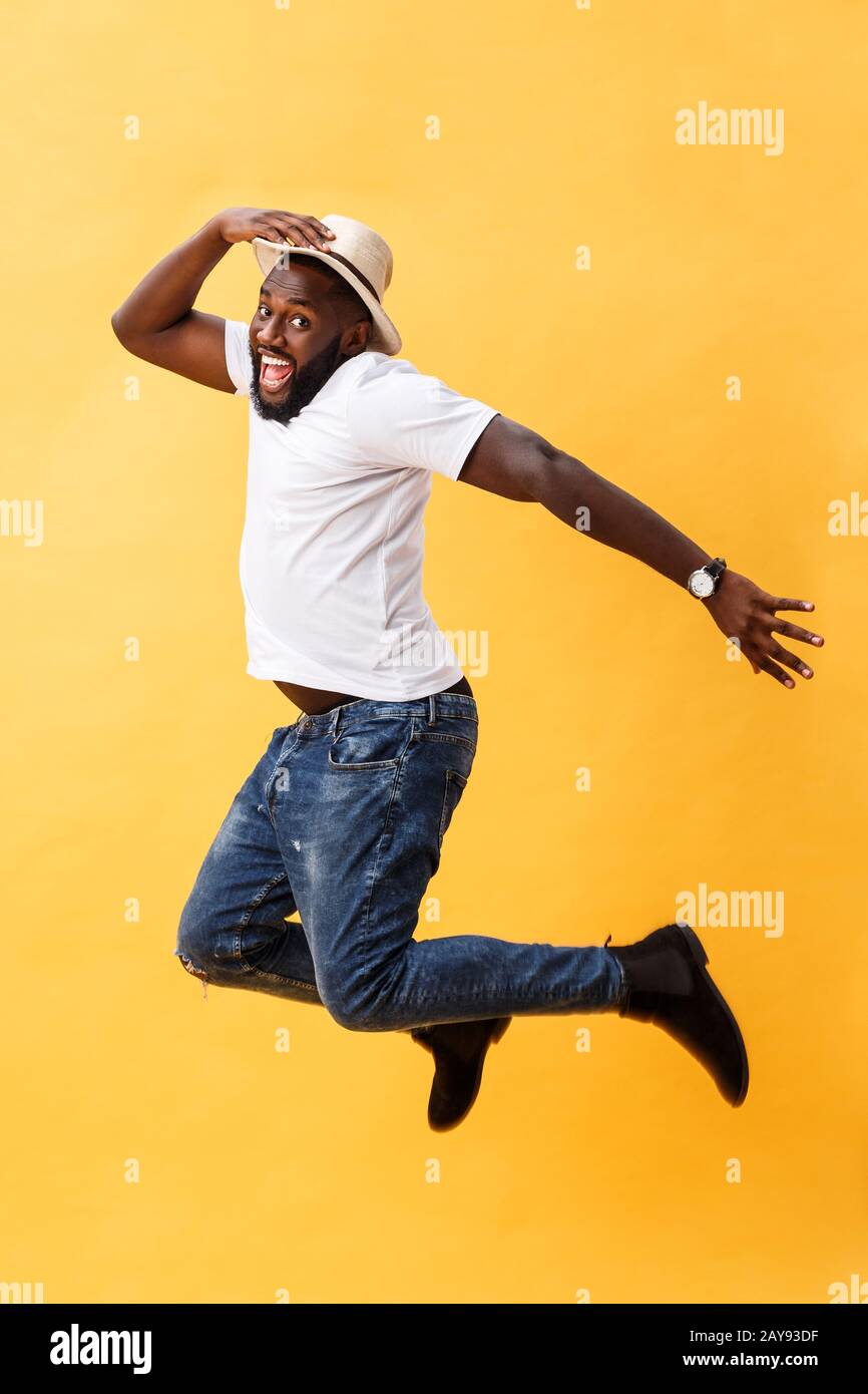 Young black man jumping hi-res stock photography and images - Alamy
