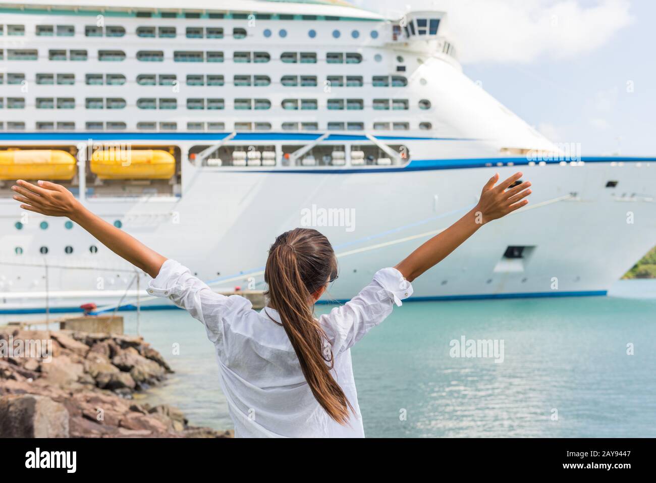Happy carefree freedom woman in front of cruise ship. Caribbean luxury ...