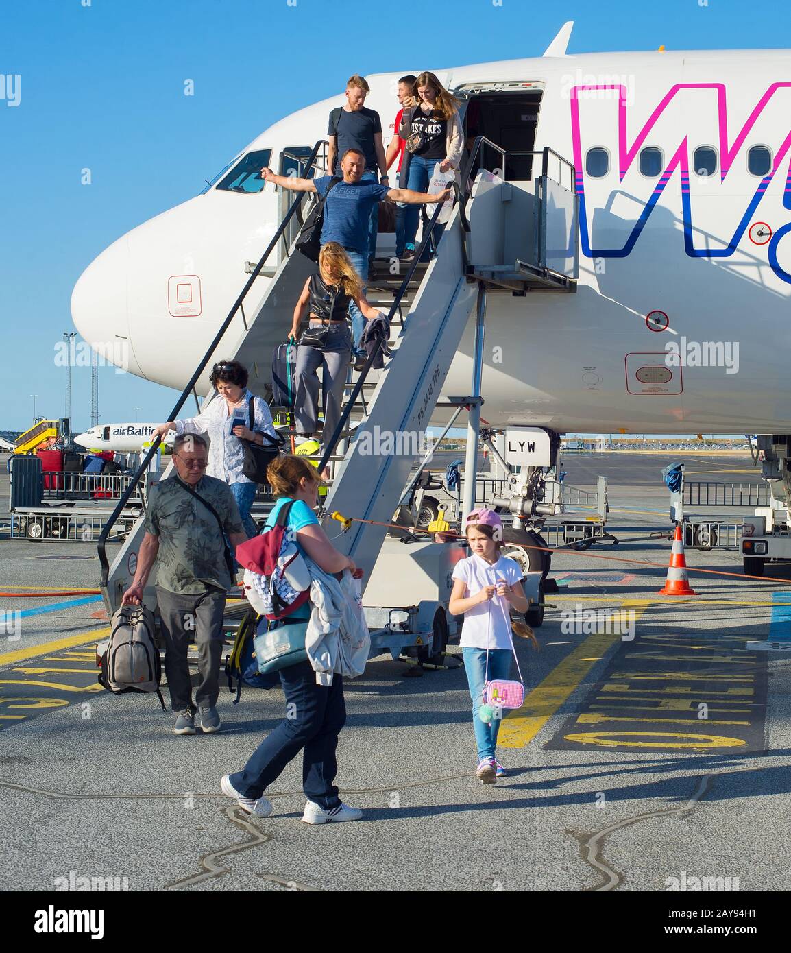 Passengers people leave airplane airport Stock Photo - Alamy
