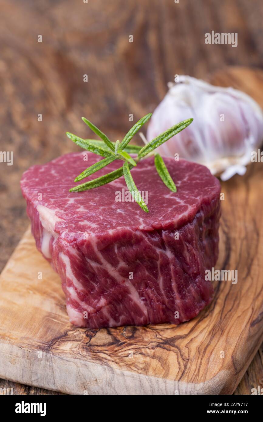 Raw steak on dark wood hi-res stock photography and images - Alamy