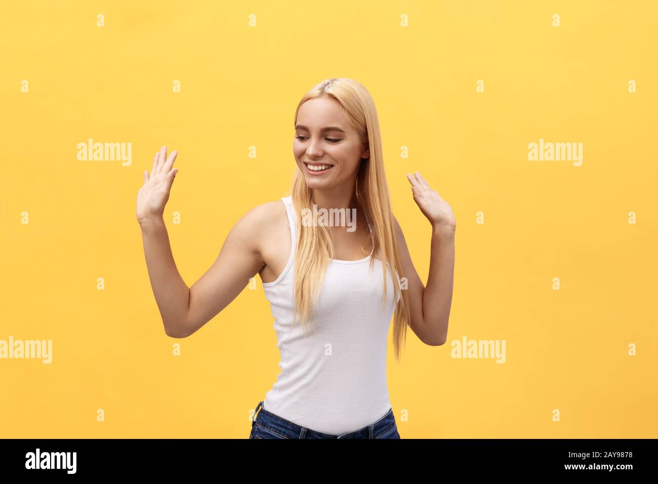 Portrait of a cheerful happy girl student while dancing isolated over ...