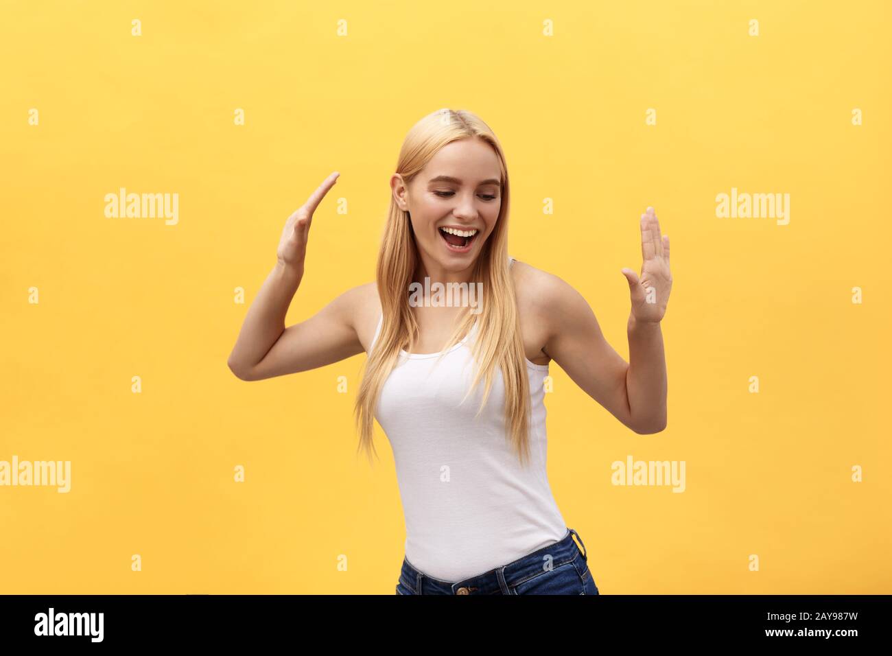 Portrait of a cheerful happy girl student while dancing isolated over ...