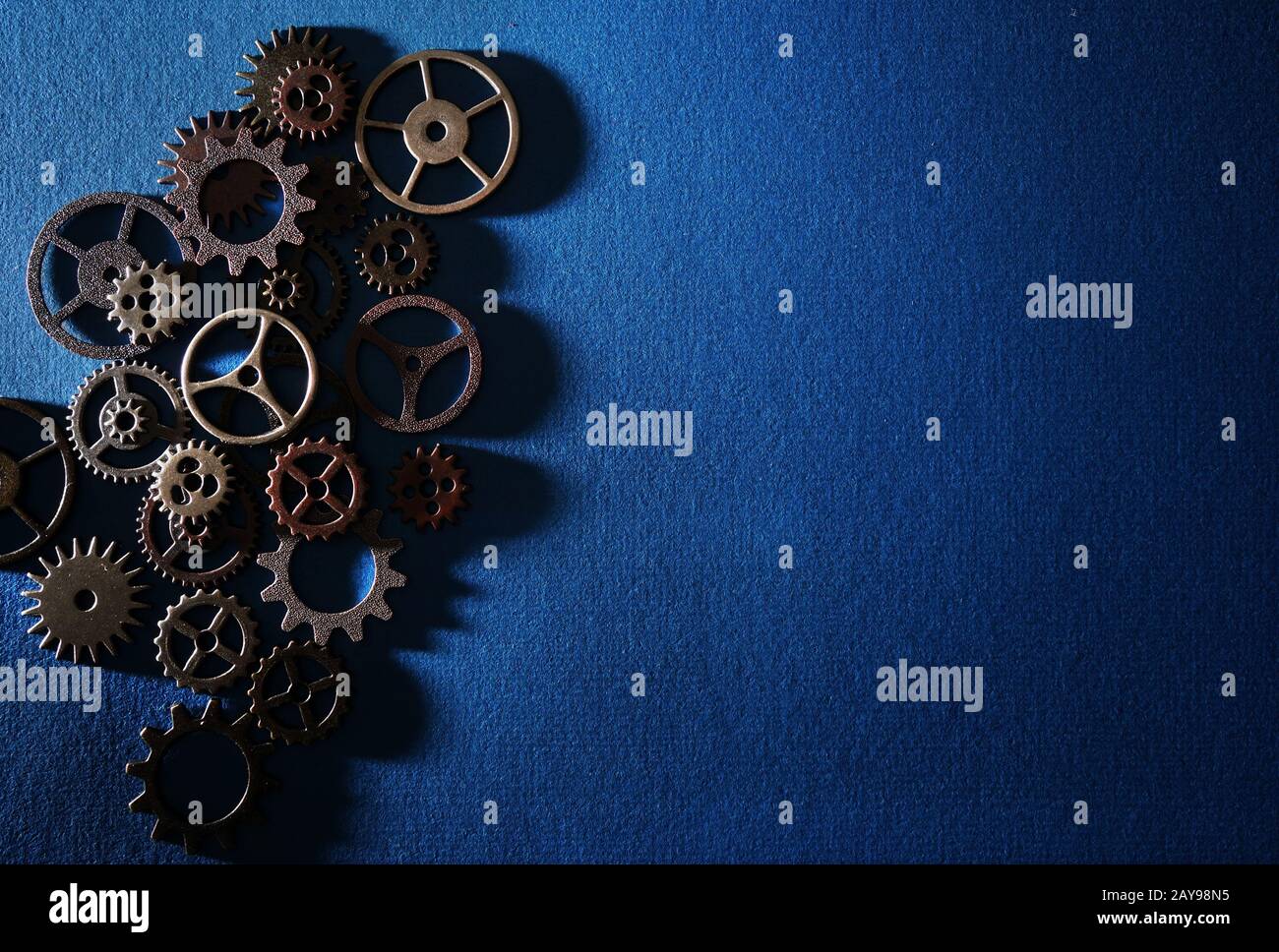 Gears on blue Stock Photo - Alamy