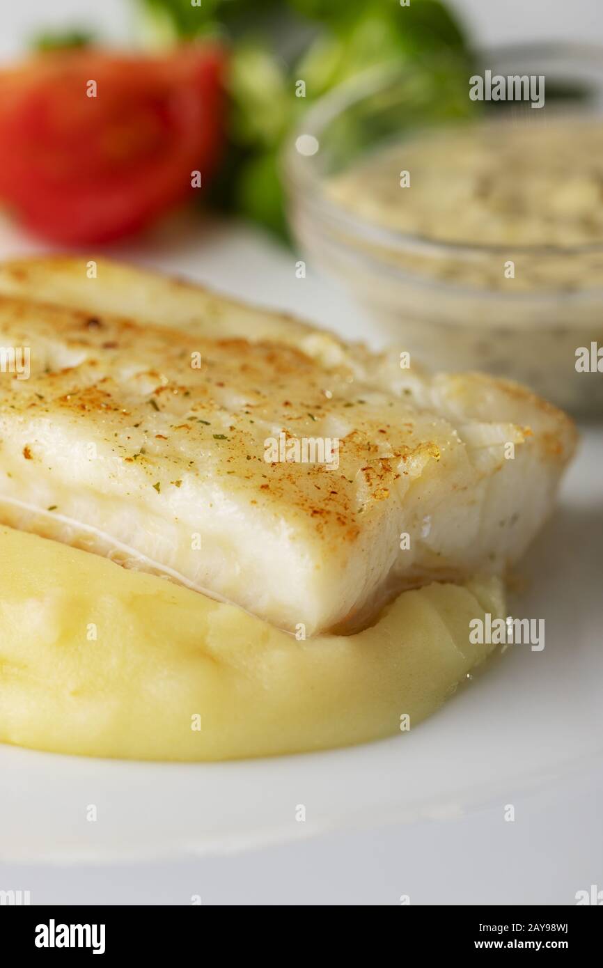 Grilled cod on a plate Stock Photo - Alamy