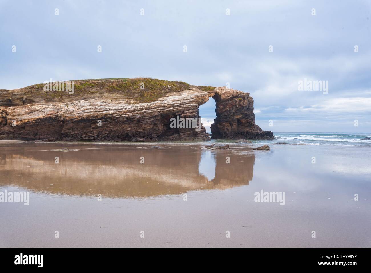 Natural rock arch in beach of Cathedrals in Lugo, Galicia, Spain Stock ...