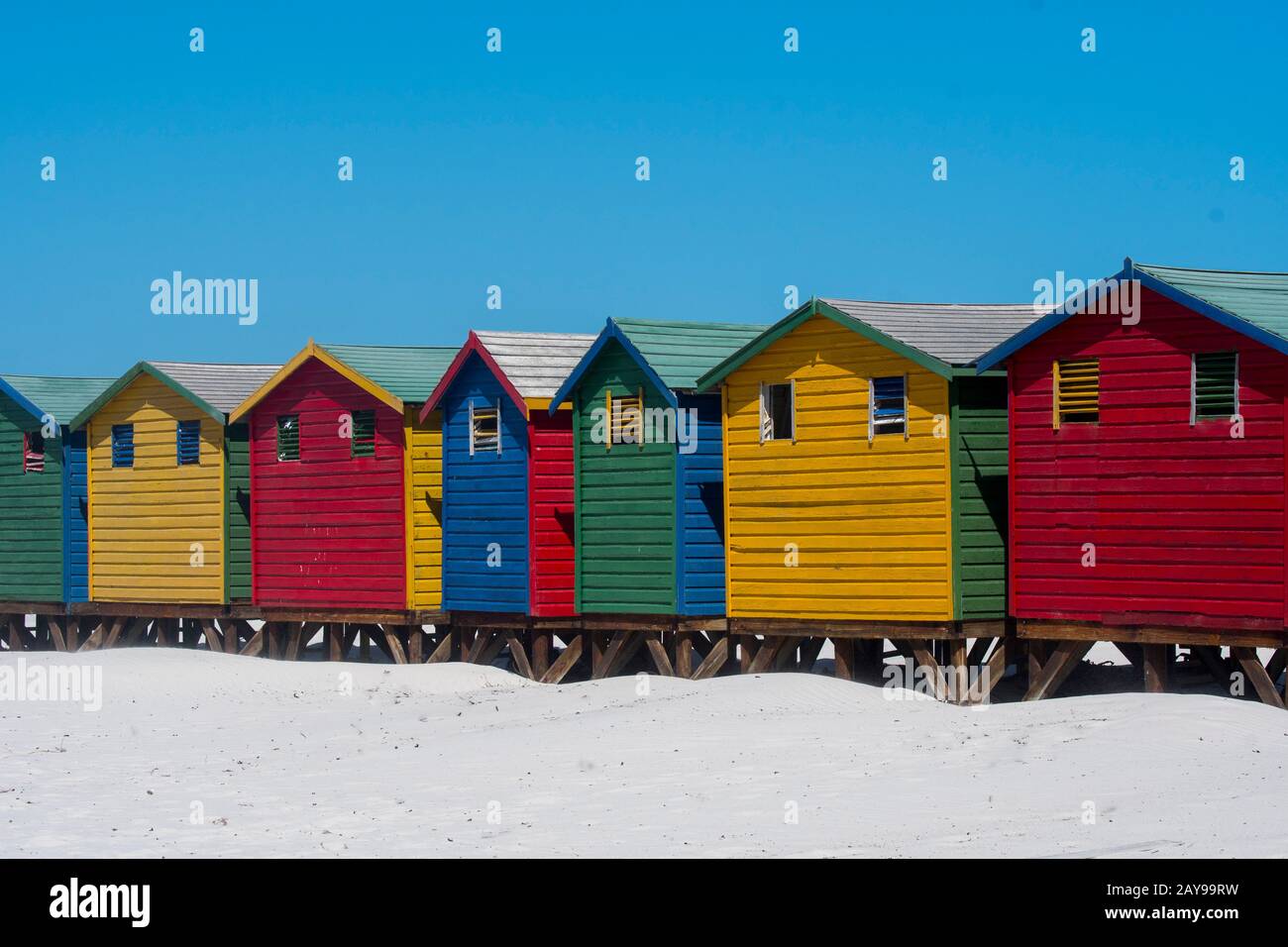 View of colorful beach changing huts on the beach at Muizenberg, a ...