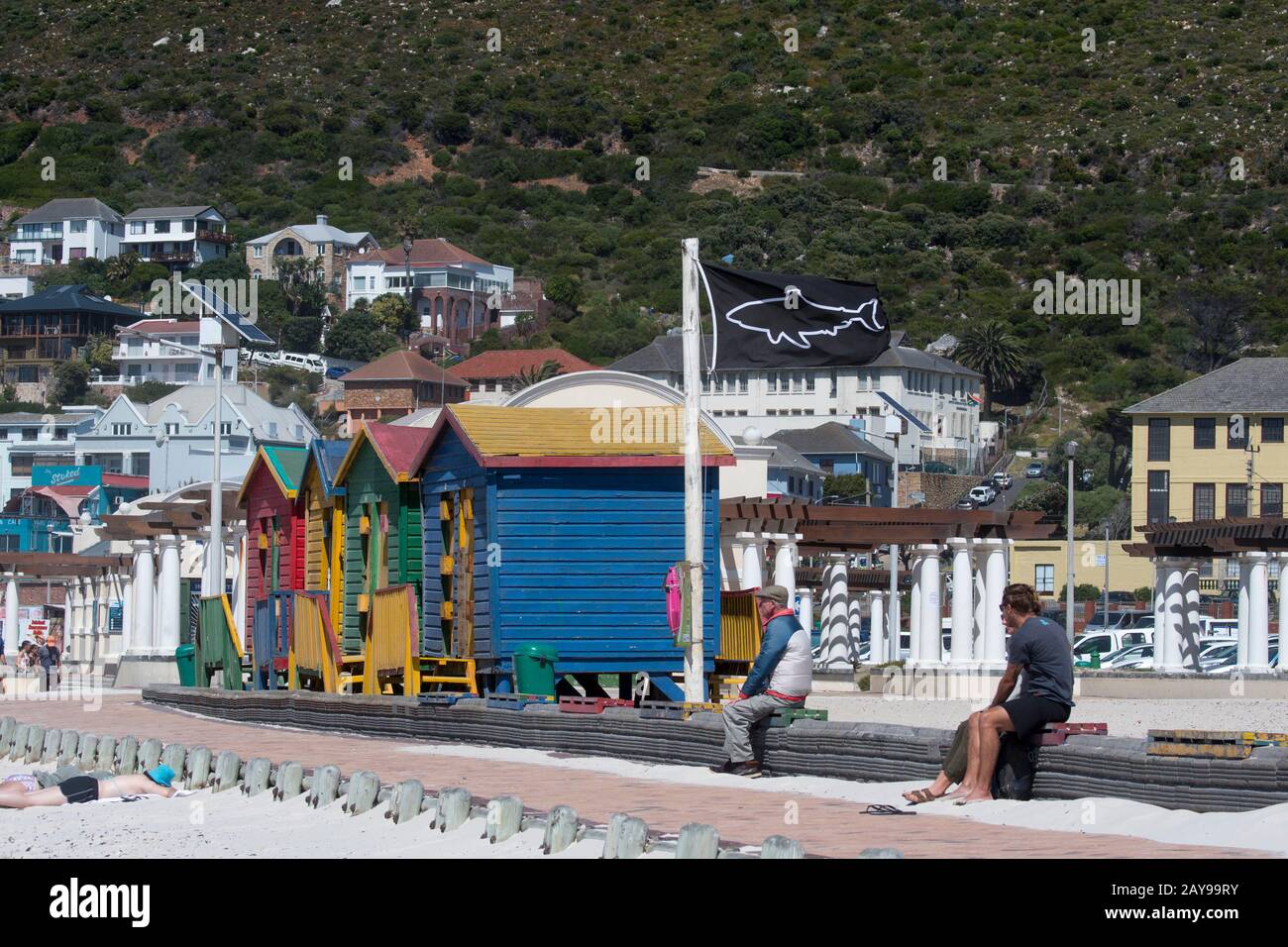 View of colorful beach changing huts on the beach at Muizenberg, a ...