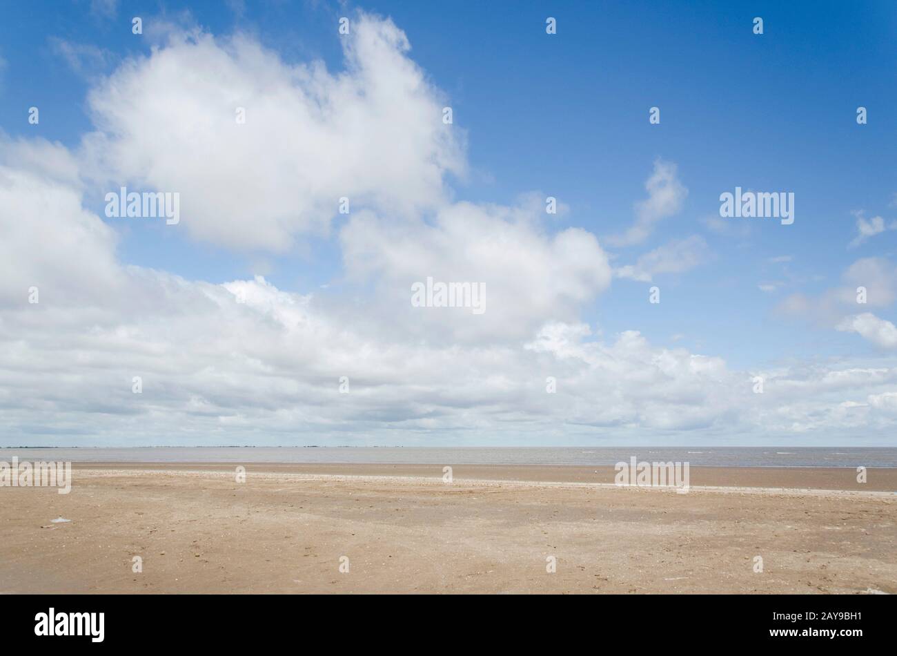 Generic beach landscape, empty; sand and a sunny sky with some clouds ...