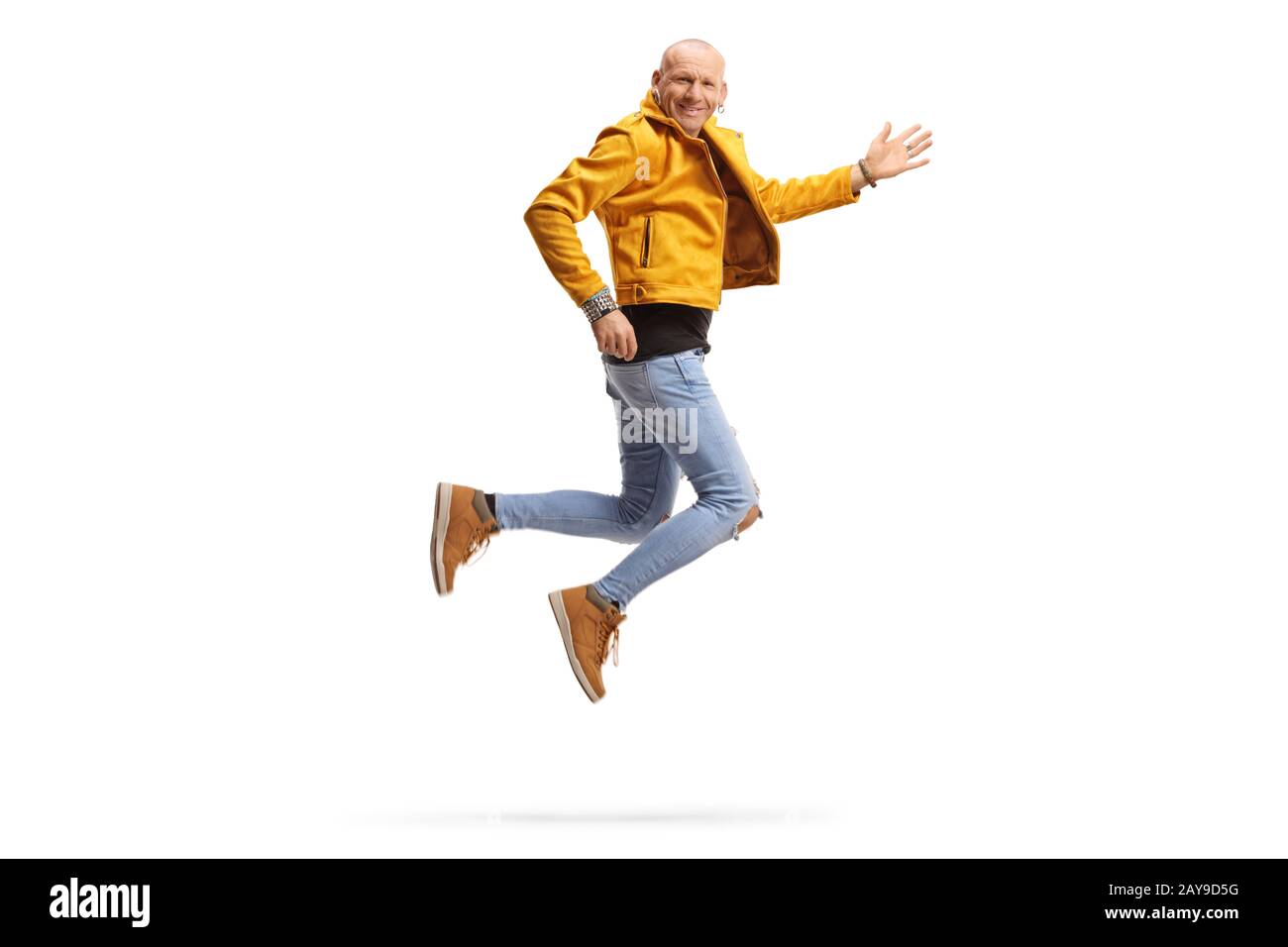Full length shot of a happy bald man in a yellow jacket smiling and ...