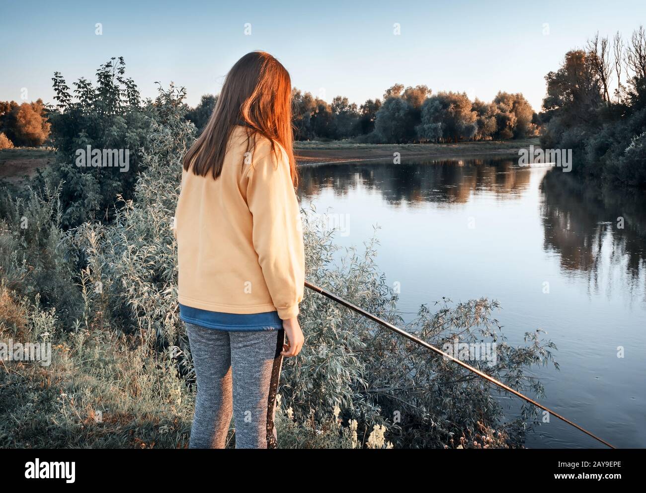 Fishing rod girl hi-res stock photography and images - Alamy