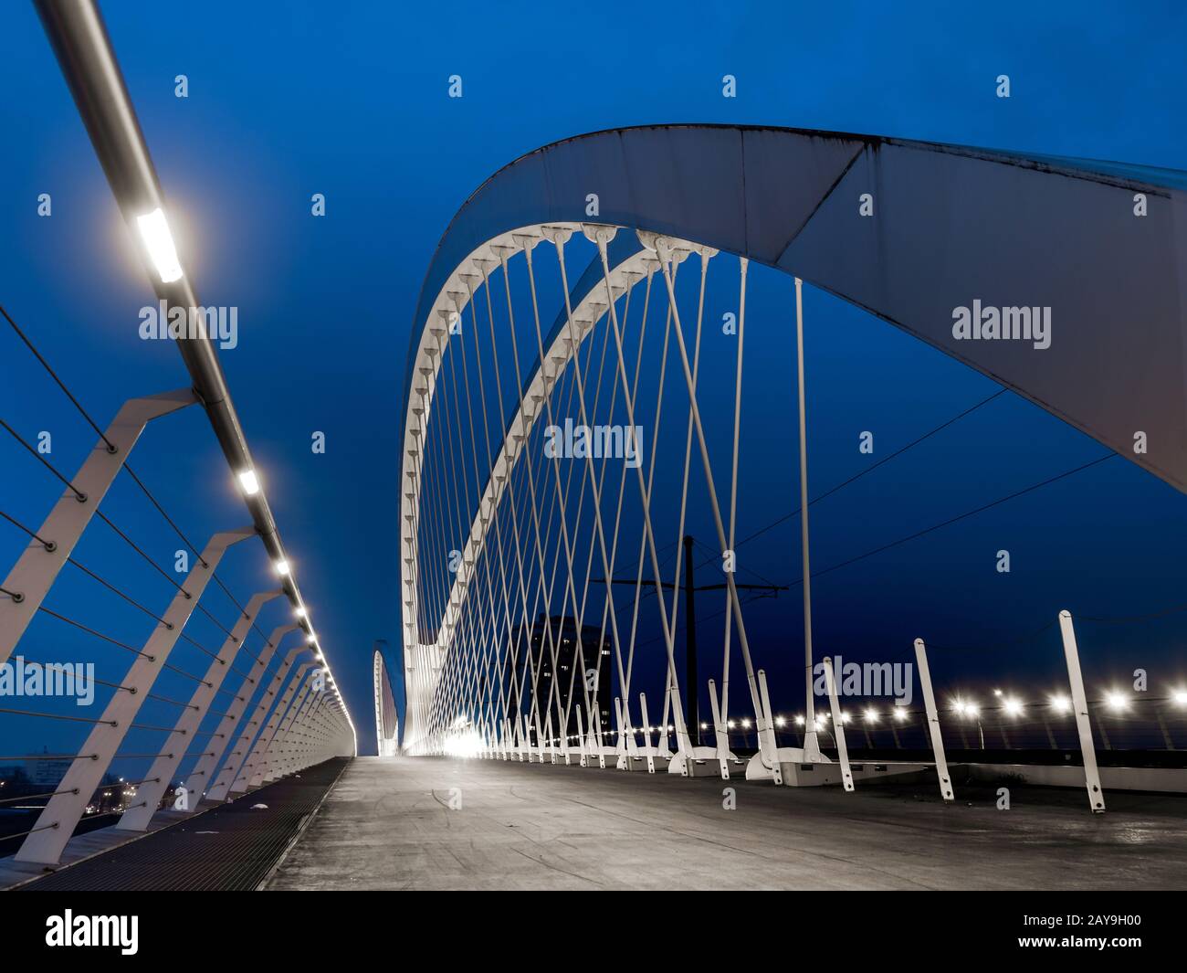 Lighted bridge between France and Germany at night. Pedestrian walkway ...