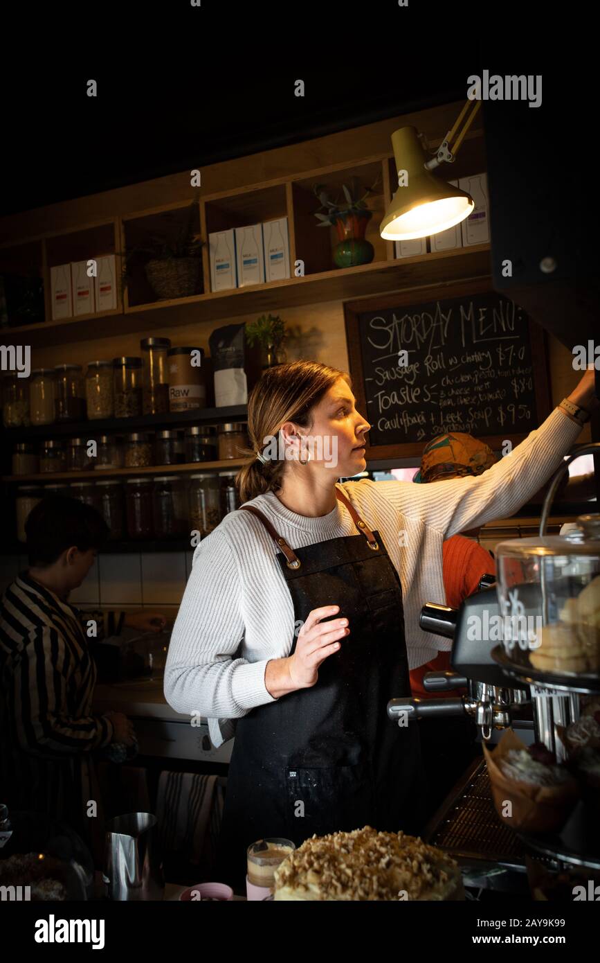 cafe owner busy at work Stock Photo - Alamy