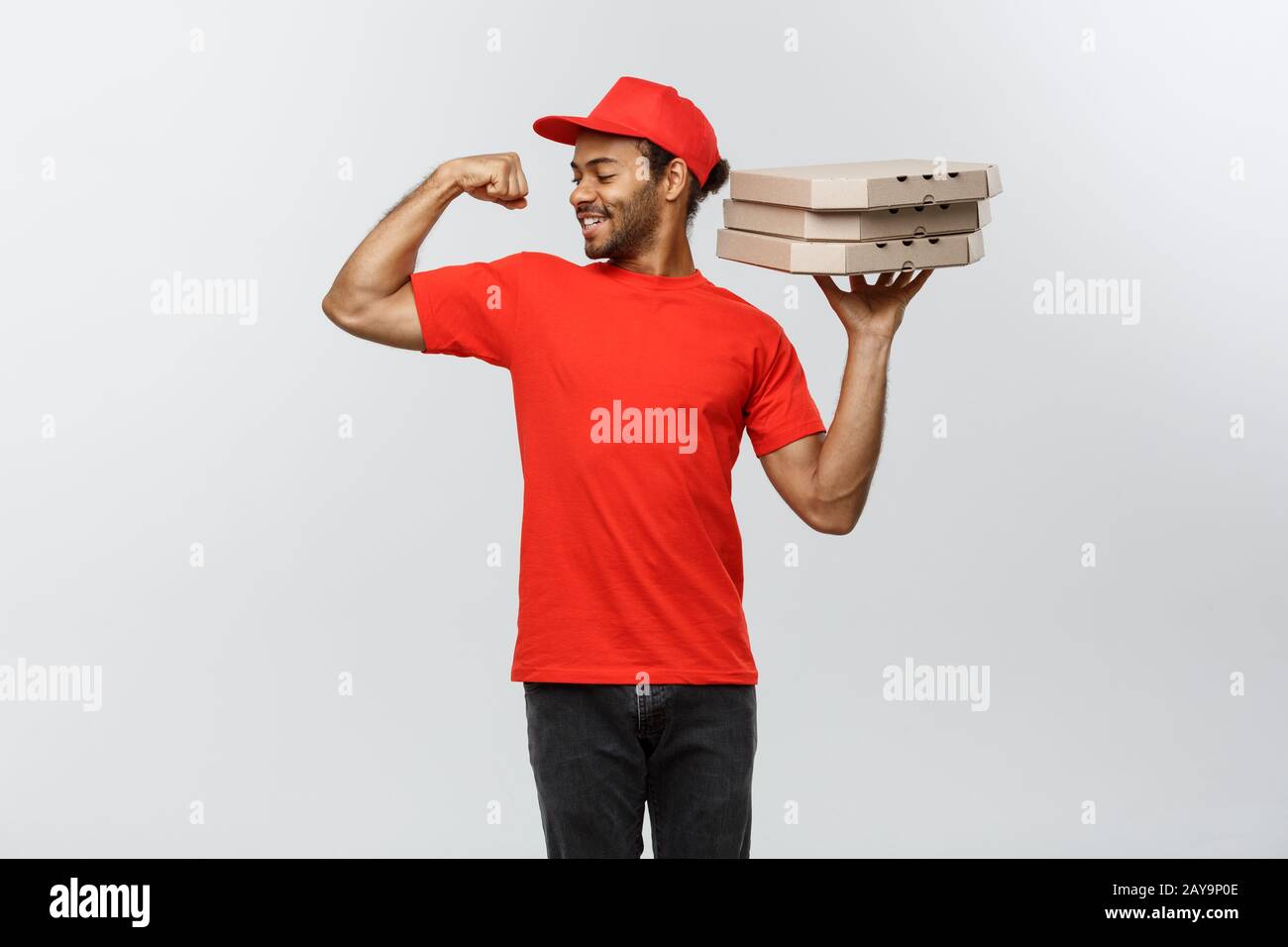 Delivery Concept - Portrait of Strong African American delivery man ...