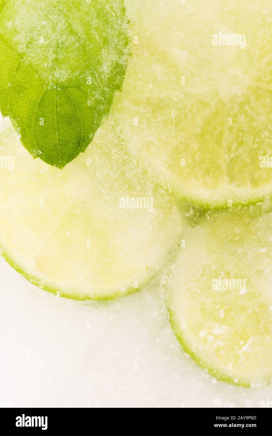 Lemon Frozen In Ice Cube Stock Photo - Alamy