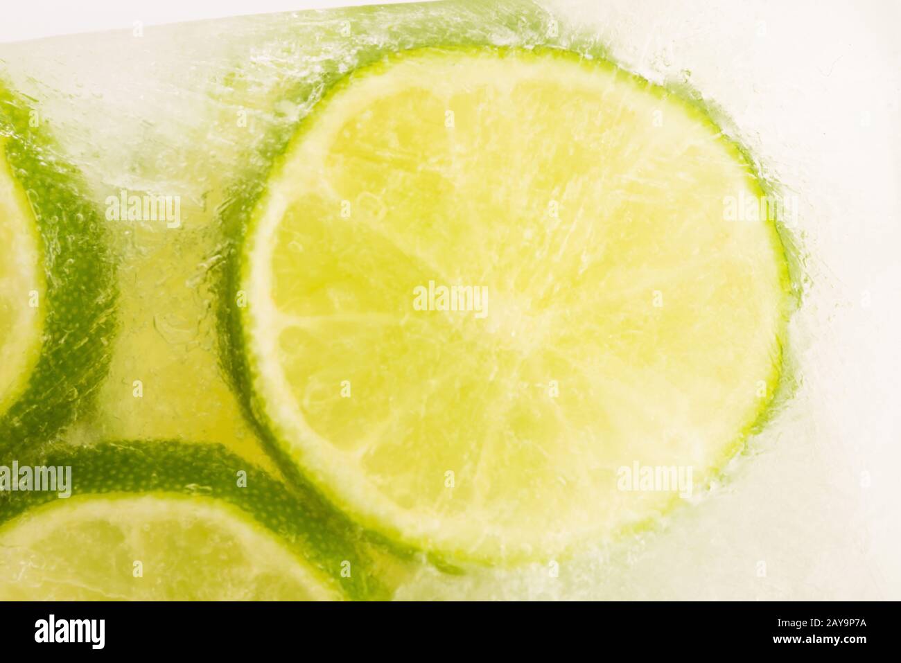 Lemon Frozen In Ice Cube Stock Photo - Alamy