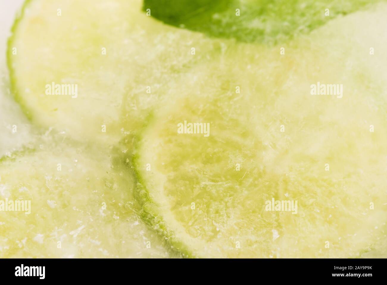 Lemon Frozen In Ice Cube Stock Photo - Alamy