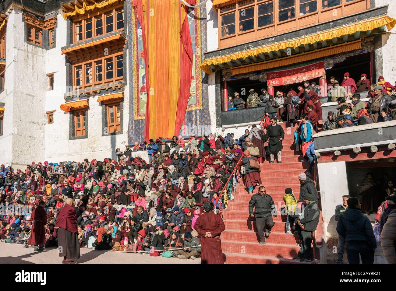 Crowds of Spituk Gustor festival goers in traditional attire crowd into ...