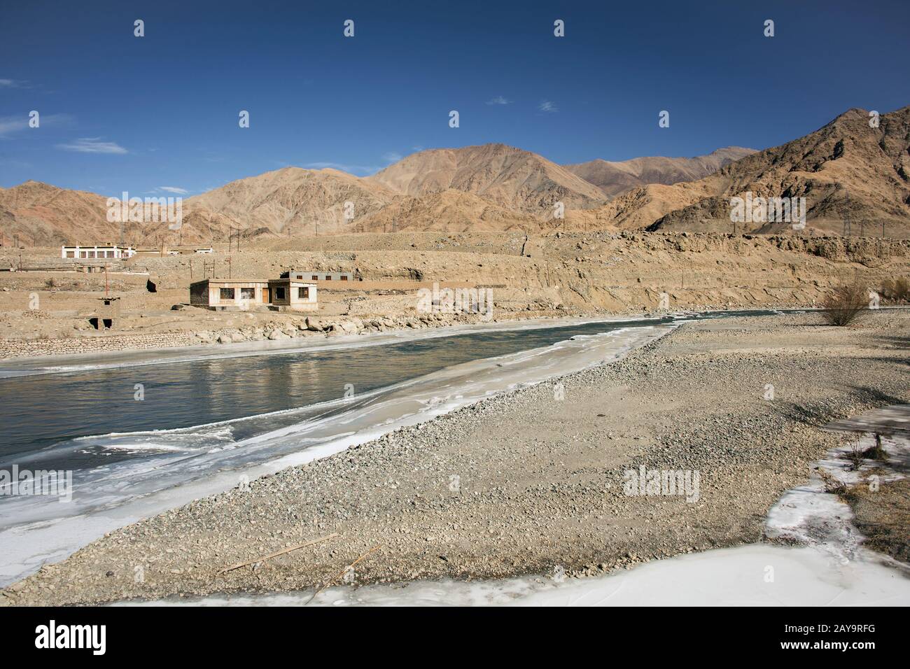 Partially frozen Indus River and Ladakh Range near the Upshi Bridge ...