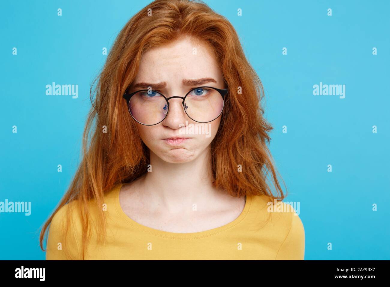 Headshot Portrait of happy ginger red hair girl with freckles smiling ...