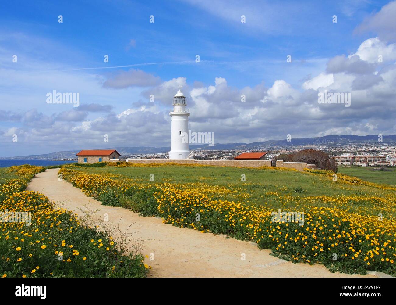 the old lighthouse in paphos cyprus surrounded by historic buildings ...