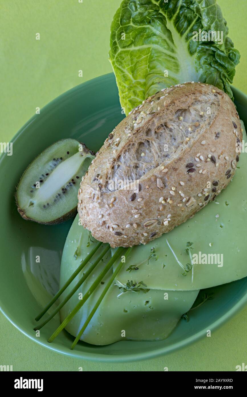 Bread roll with Dutch wasabi cheese Stock Photo - Alamy